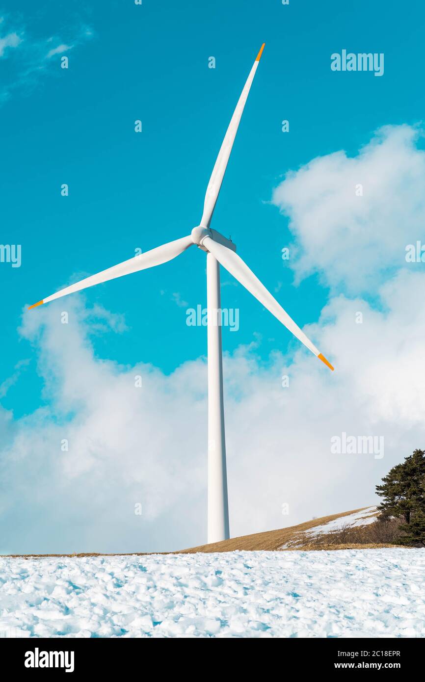 Electric Turbine Windmill on a blue sky. Closeup image of turbines ...