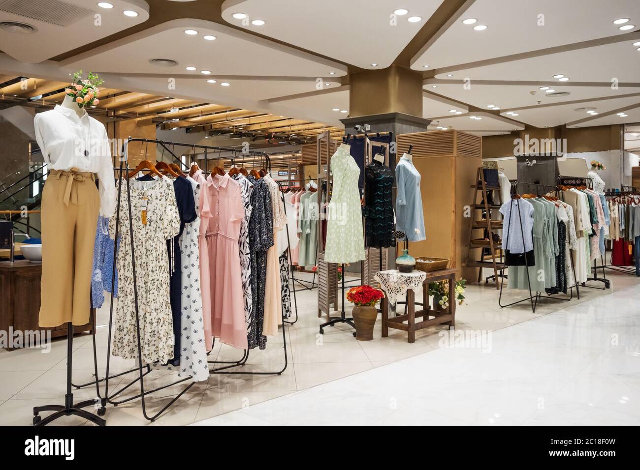 fashionable clothes in modern shopping mall Stock Photo - Alamy