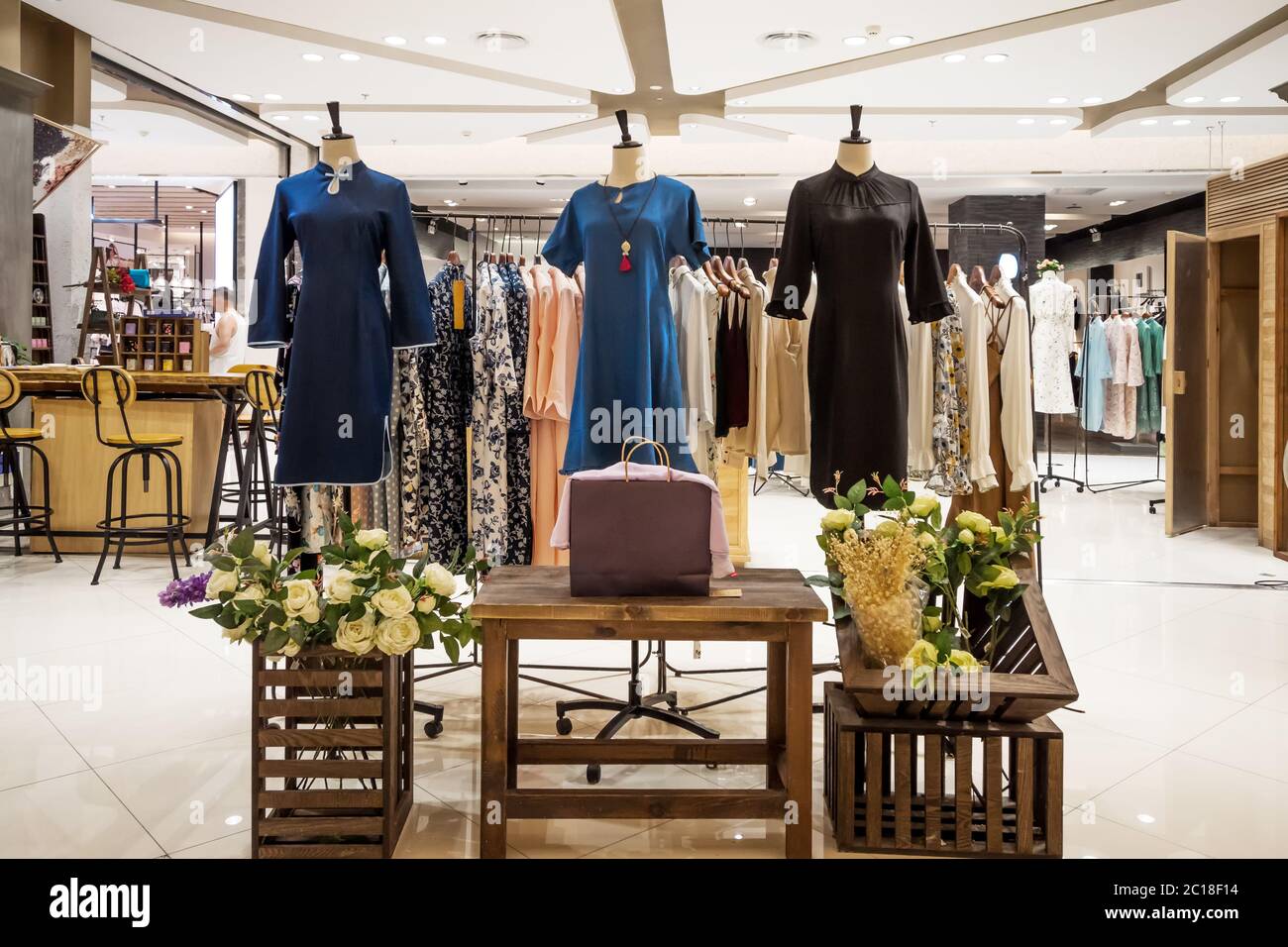 fashionable clothes in modern shopping mall Stock Photo - Alamy