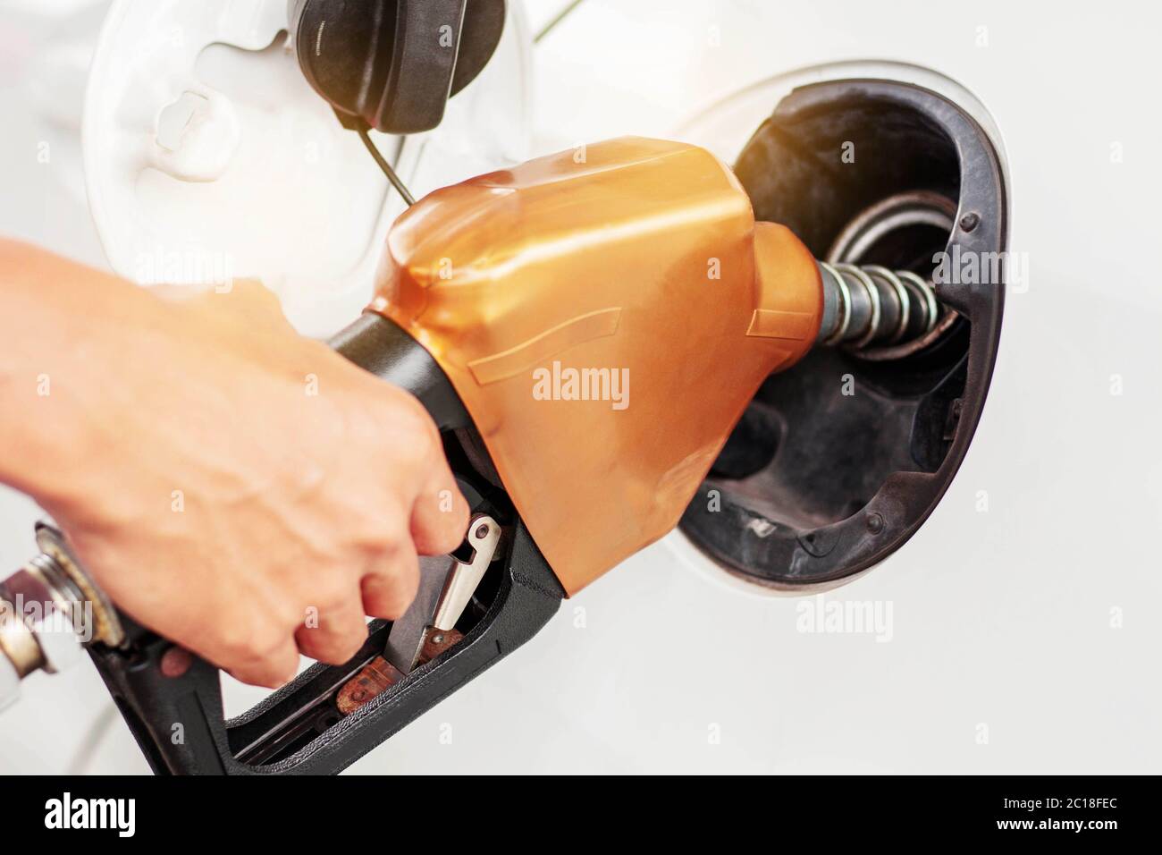 hands dispensing fuel for cars Stock Photo - Alamy