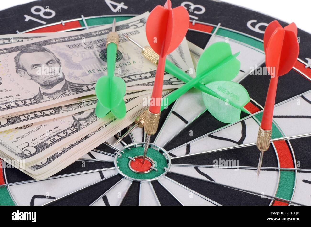 The money on a dartboard background Stock Photo - Alamy