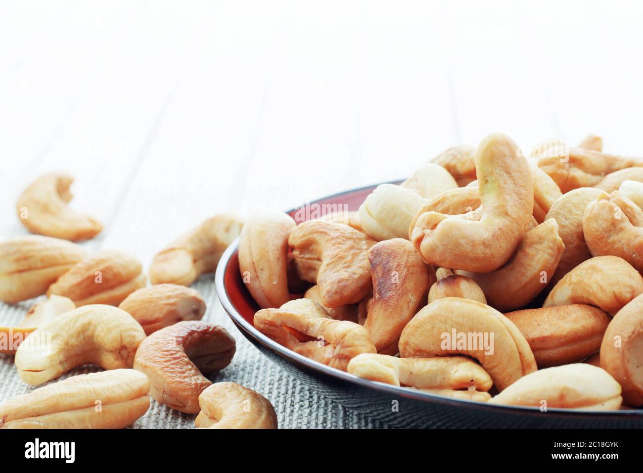 Cashew salt roasted with white background Stock Photo - Alamy