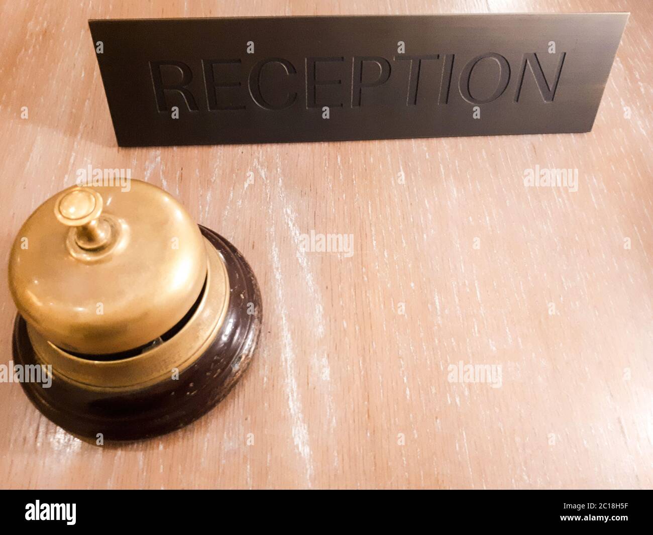 Bell at reception desk Stock Photo - Alamy