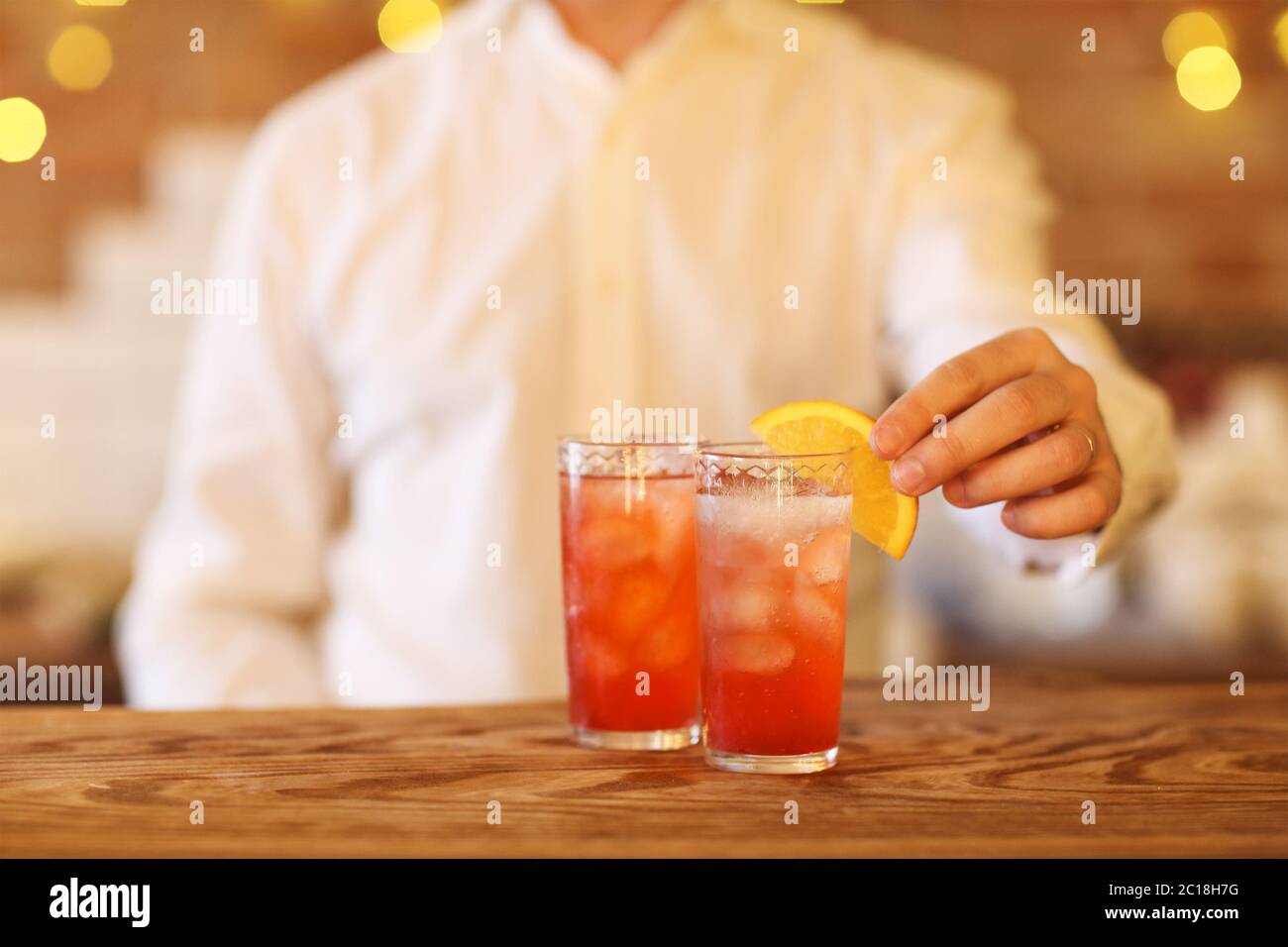 Bartender making two cocktails Stock Photo - Alamy