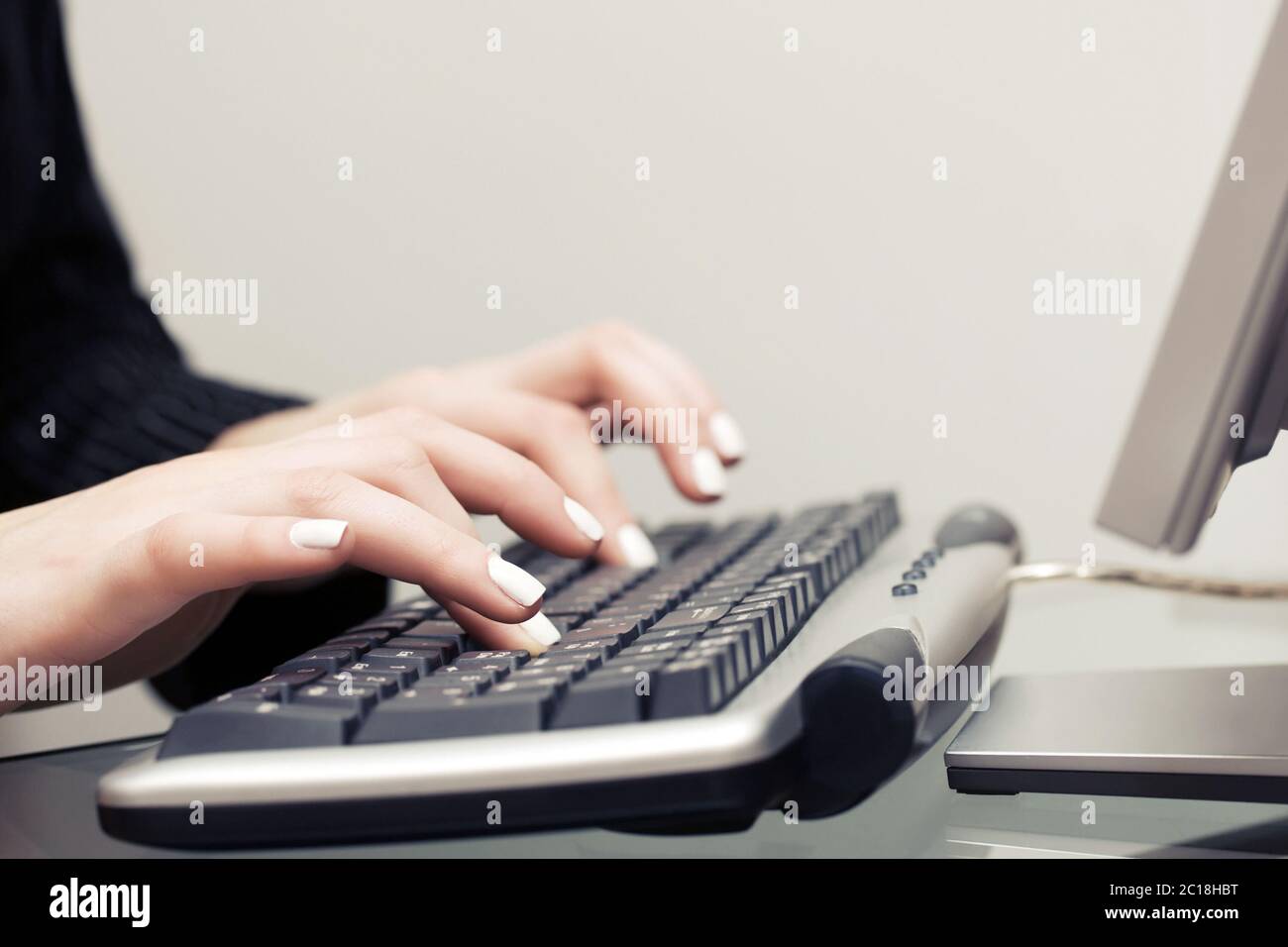 Black woman typing at computer hi-res stock photography and images - Alamy