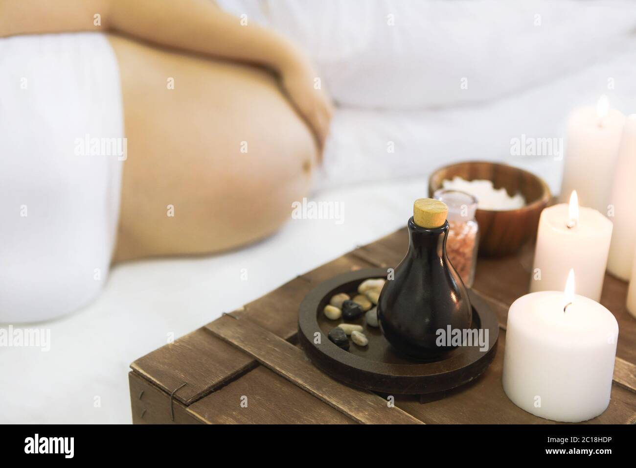 Young pregnant woman have massage treatment at spa Stock Photo - Alamy