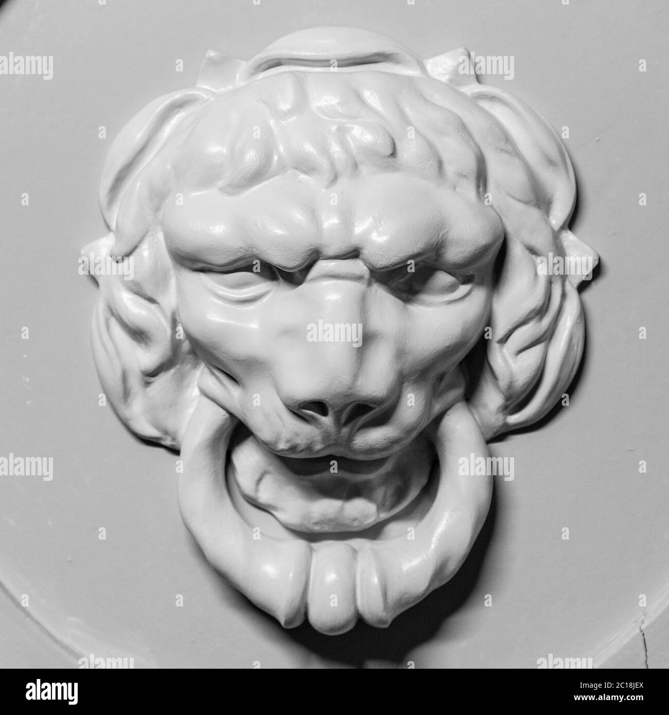 Lion head relief on the facade Stock Photo - Alamy