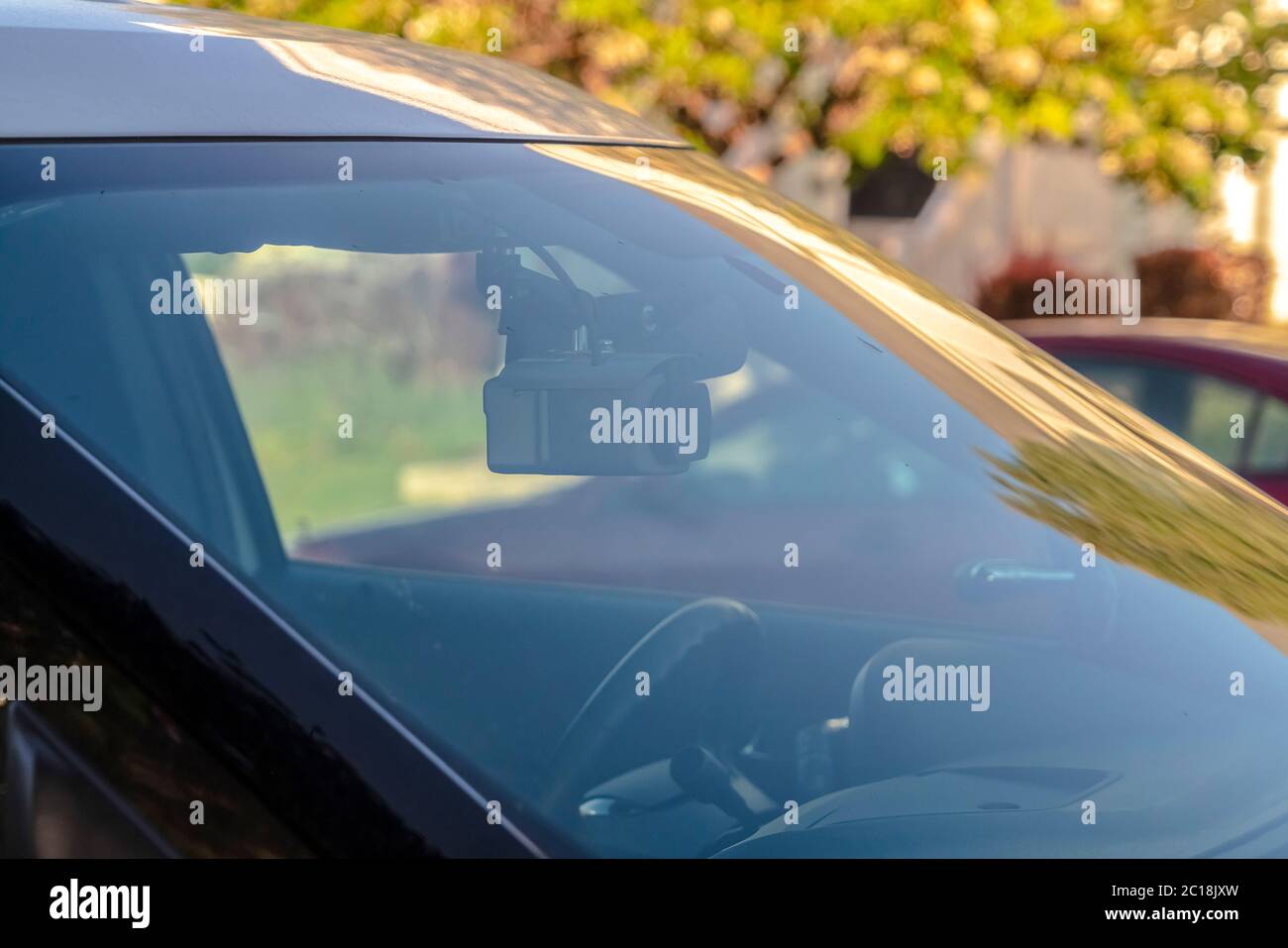 Windshield of sheriffs car with dashboard camera Stock Photo - Alamy
