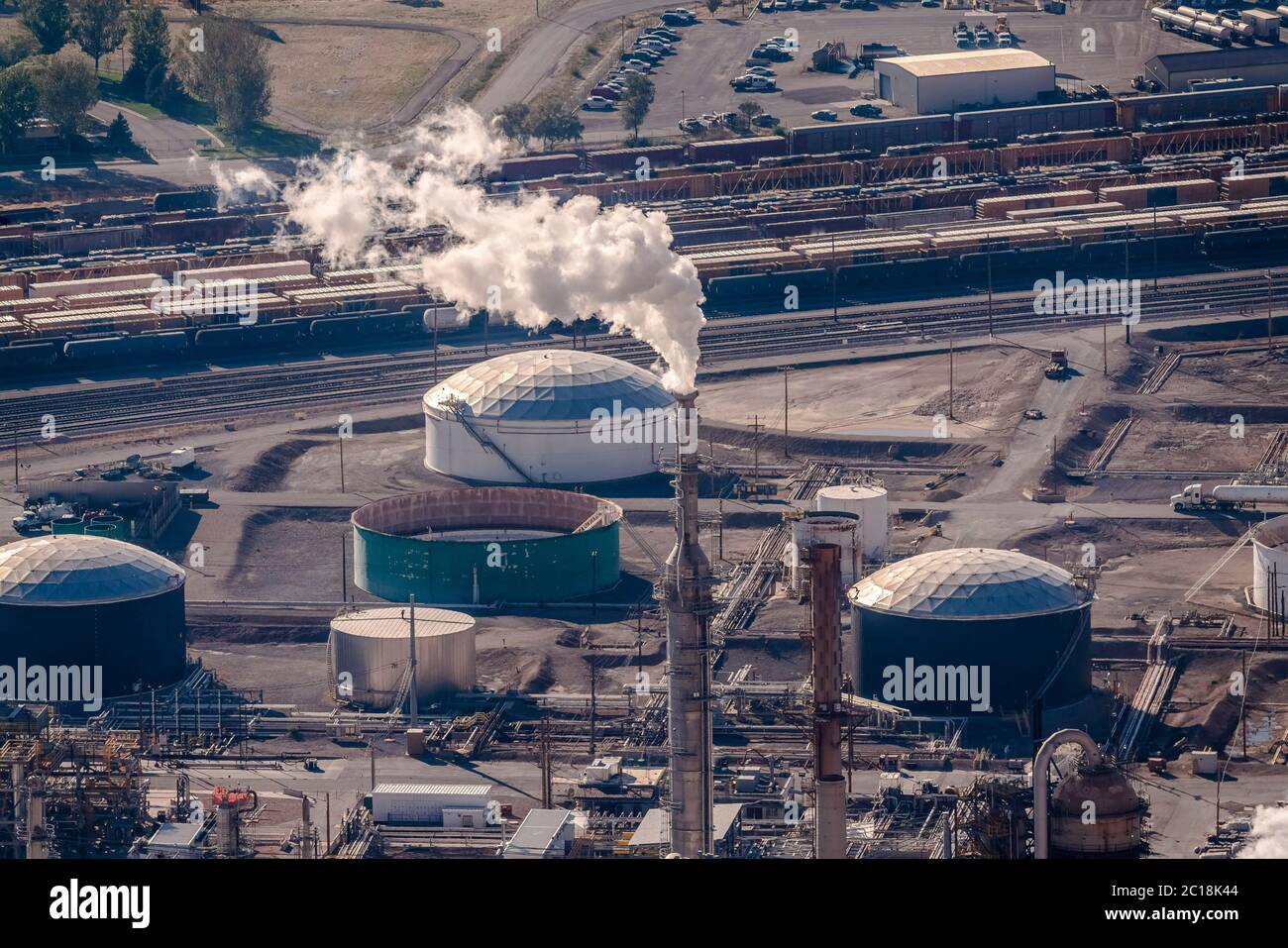 Industrial chimney belching smoke at a refinery Stock Photo - Alamy