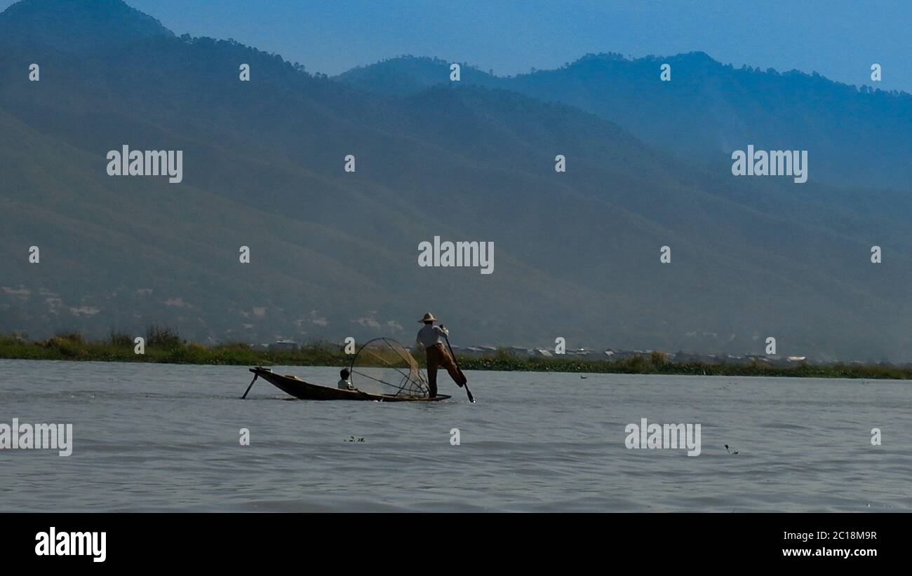 Fisherman paddle boat hi-res stock photography and images - Alamy