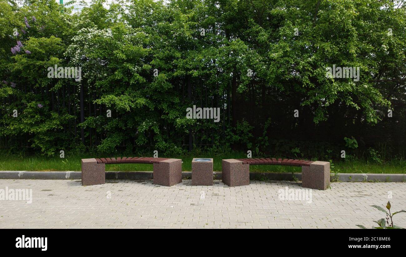Two wooden benches next to each other Stock Photo - Alamy