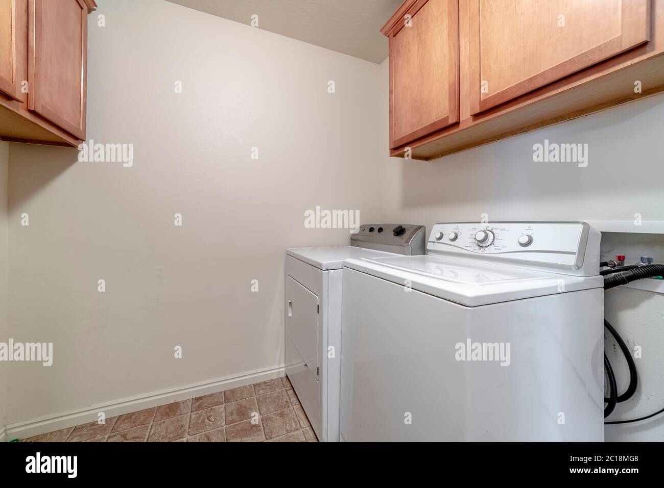 Laundry interior with washer and dryer interior Stock Photo - Alamy