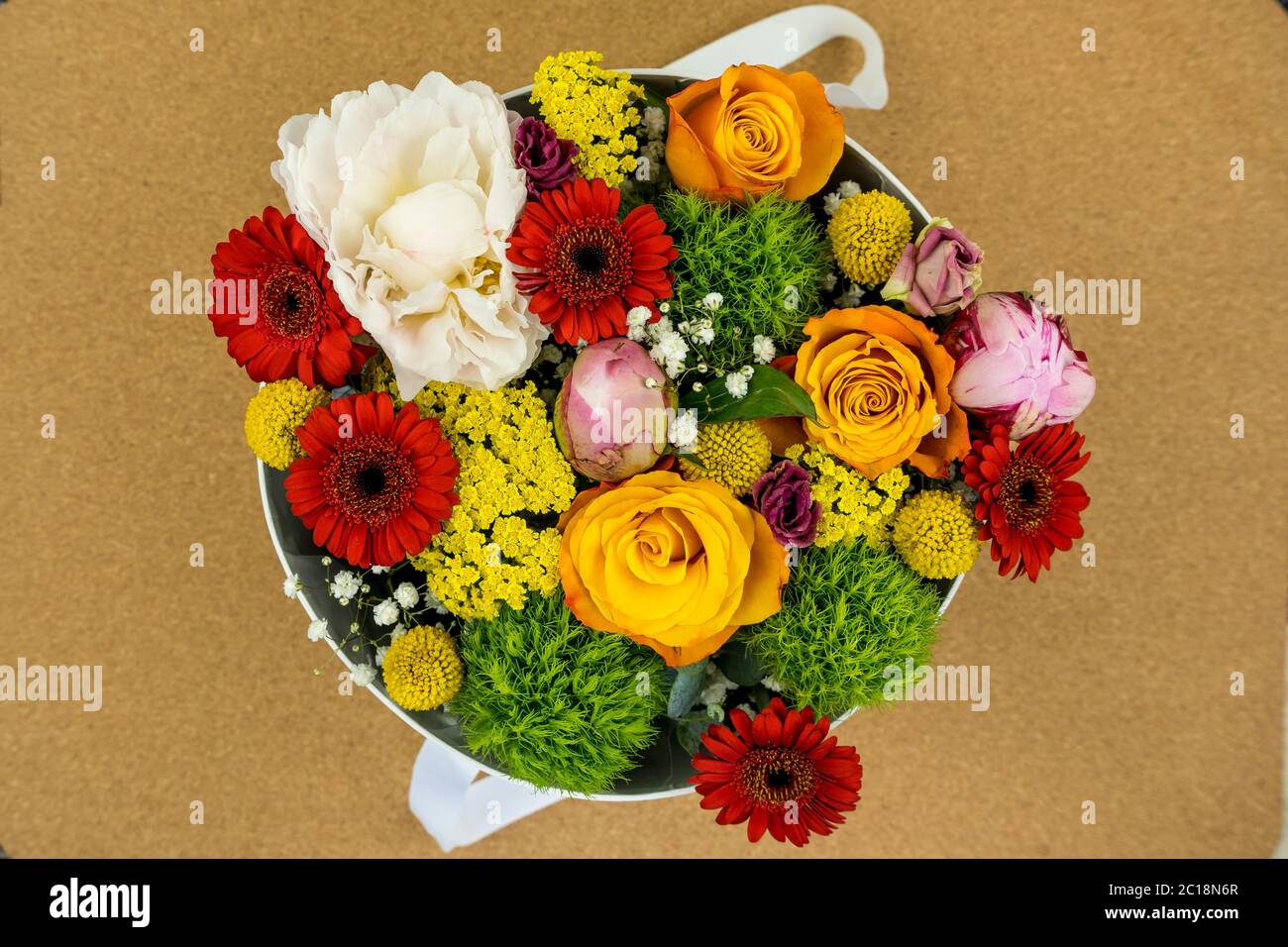 Flower bouquet of different colorful on the natural wood background ...