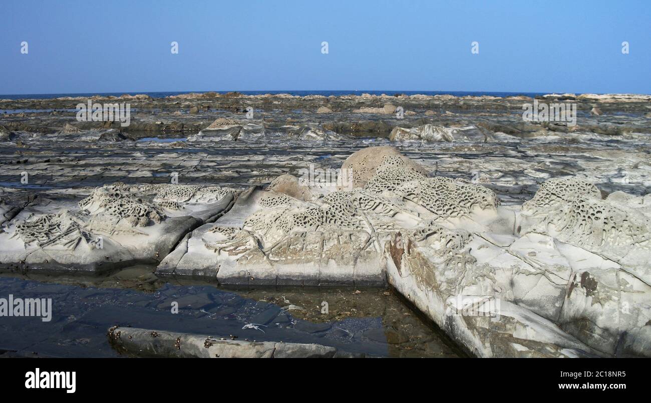 Polished rocky shore Ngapali beach Stock Photo - Alamy