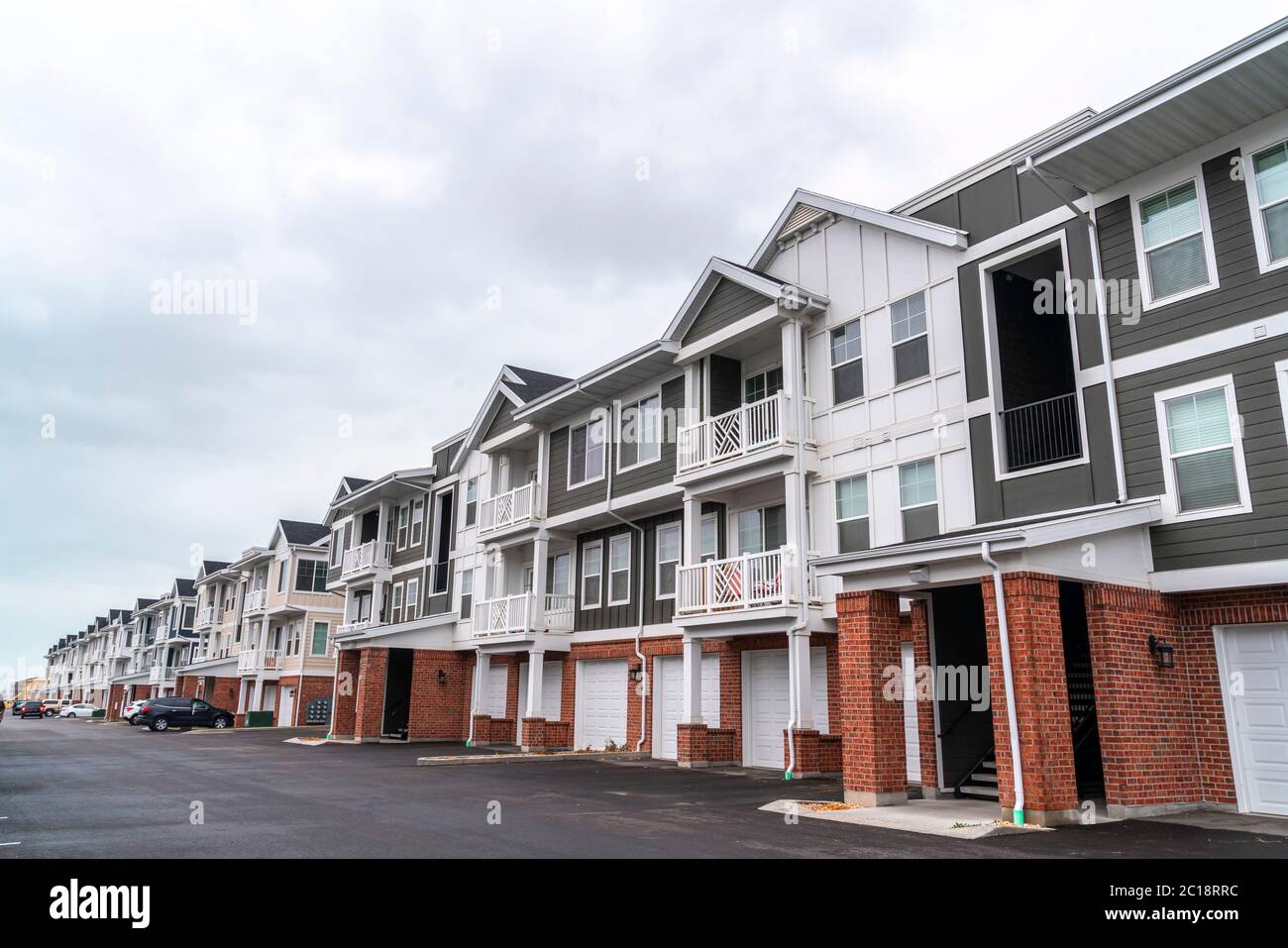 Long receding row of urban apartments day light Stock Photo - Alamy