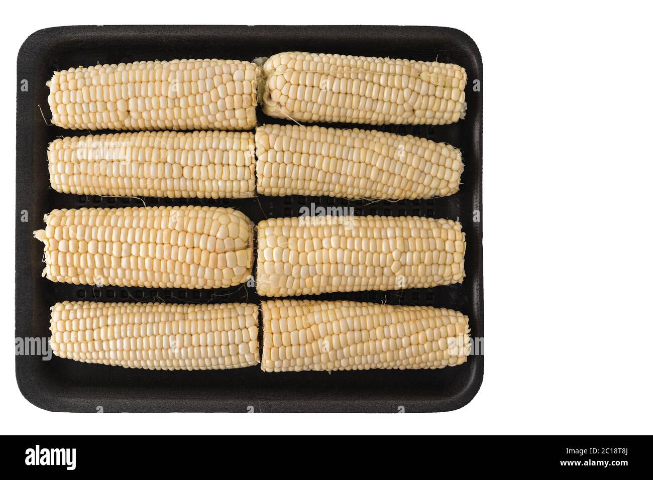 Raw corn close up. Fresh uncooked organic sweet corn in plastic ...