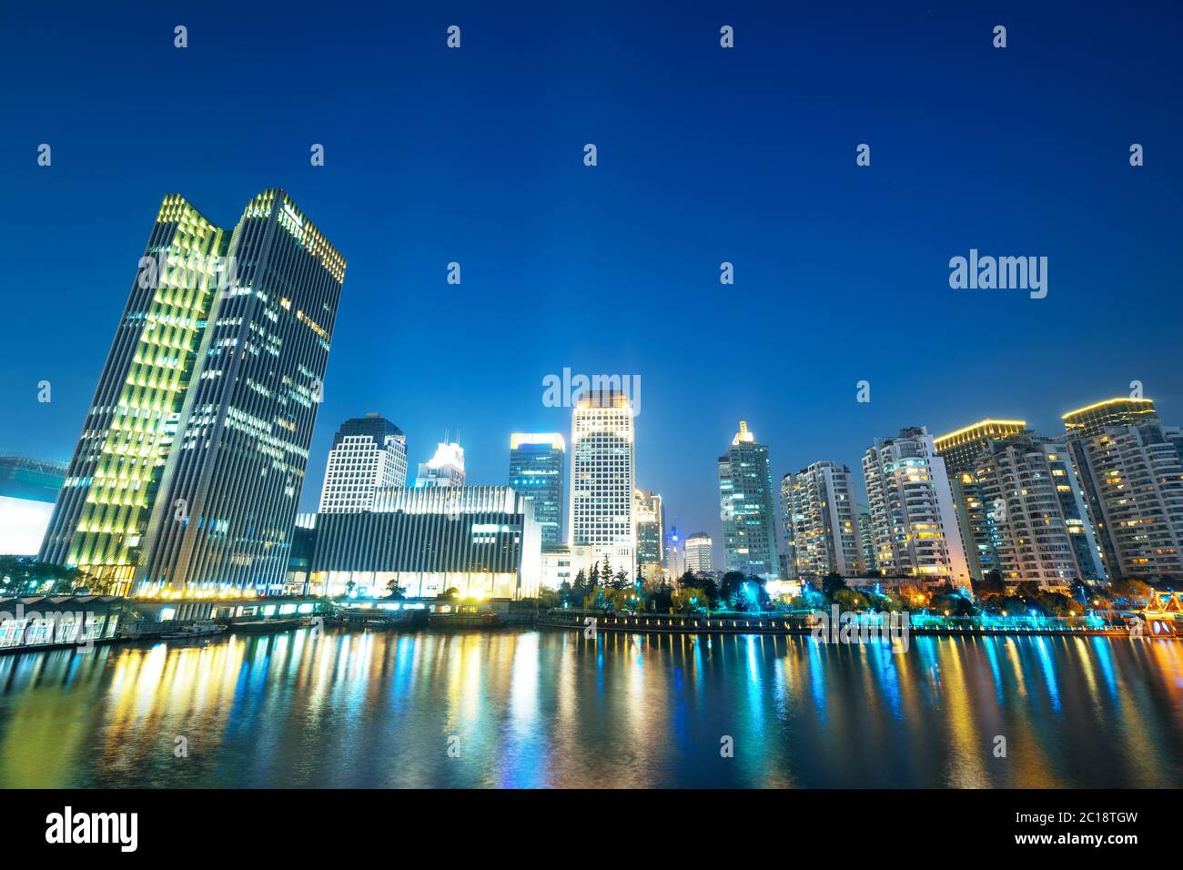 modern buildings near water at night Stock Photo - Alamy