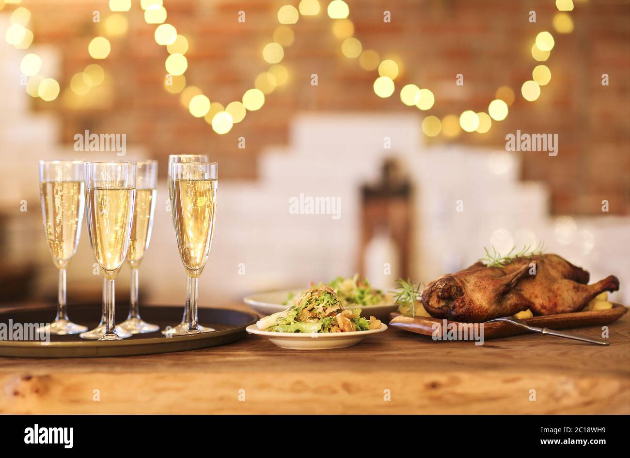 Winter holiday family dinner with roast poultry and champagne Stock ...