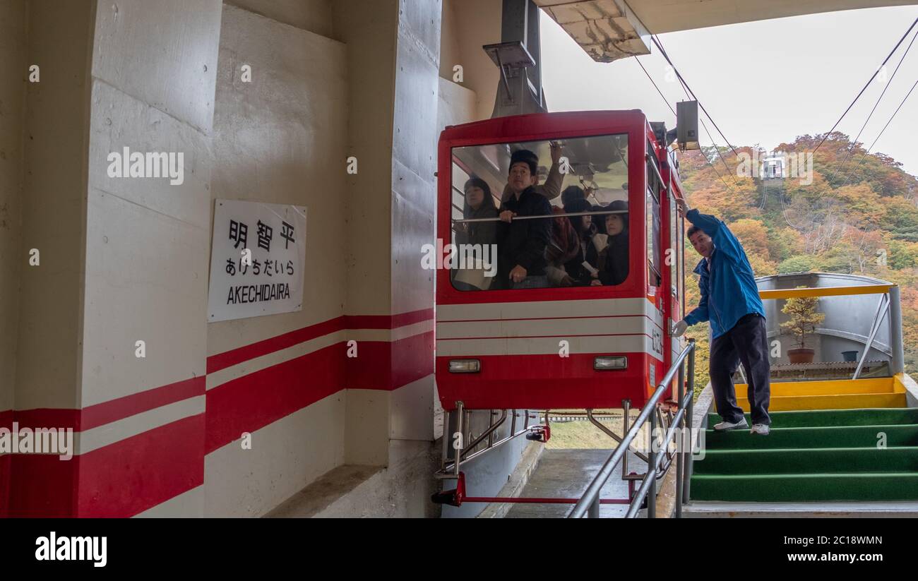 Tourists riding the Akechidaira Ropeway cable car at Nikko, Japan ...