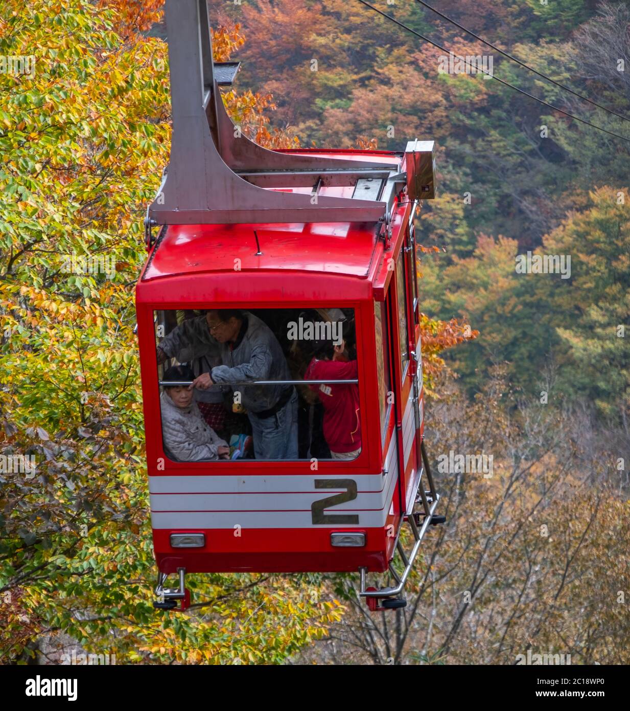 Tourists riding the Akechidaira Ropeway cable car at Nikko, Japan ...