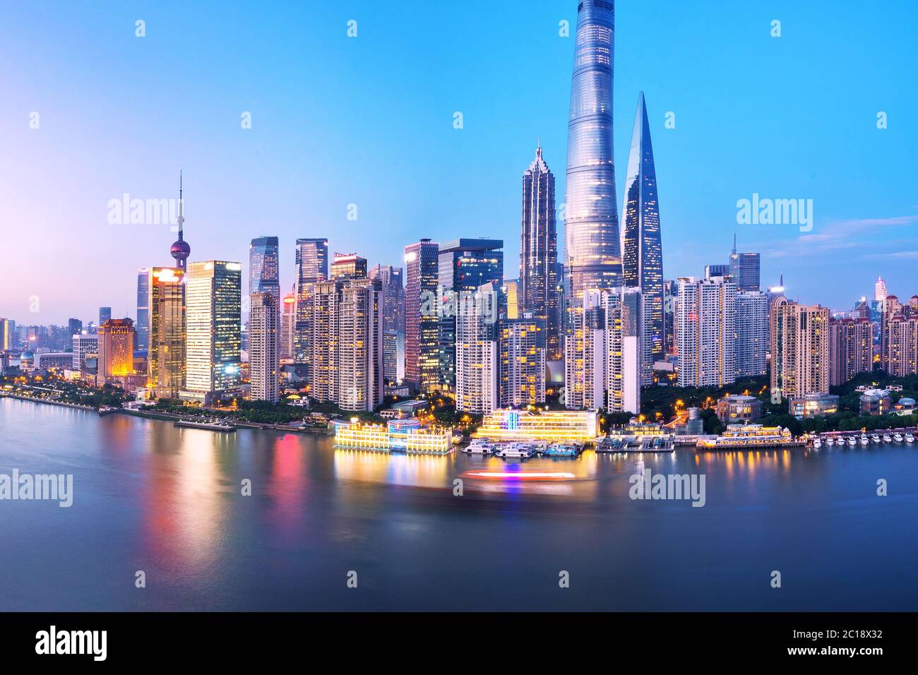 modern buildings near water at twilight Stock Photo - Alamy