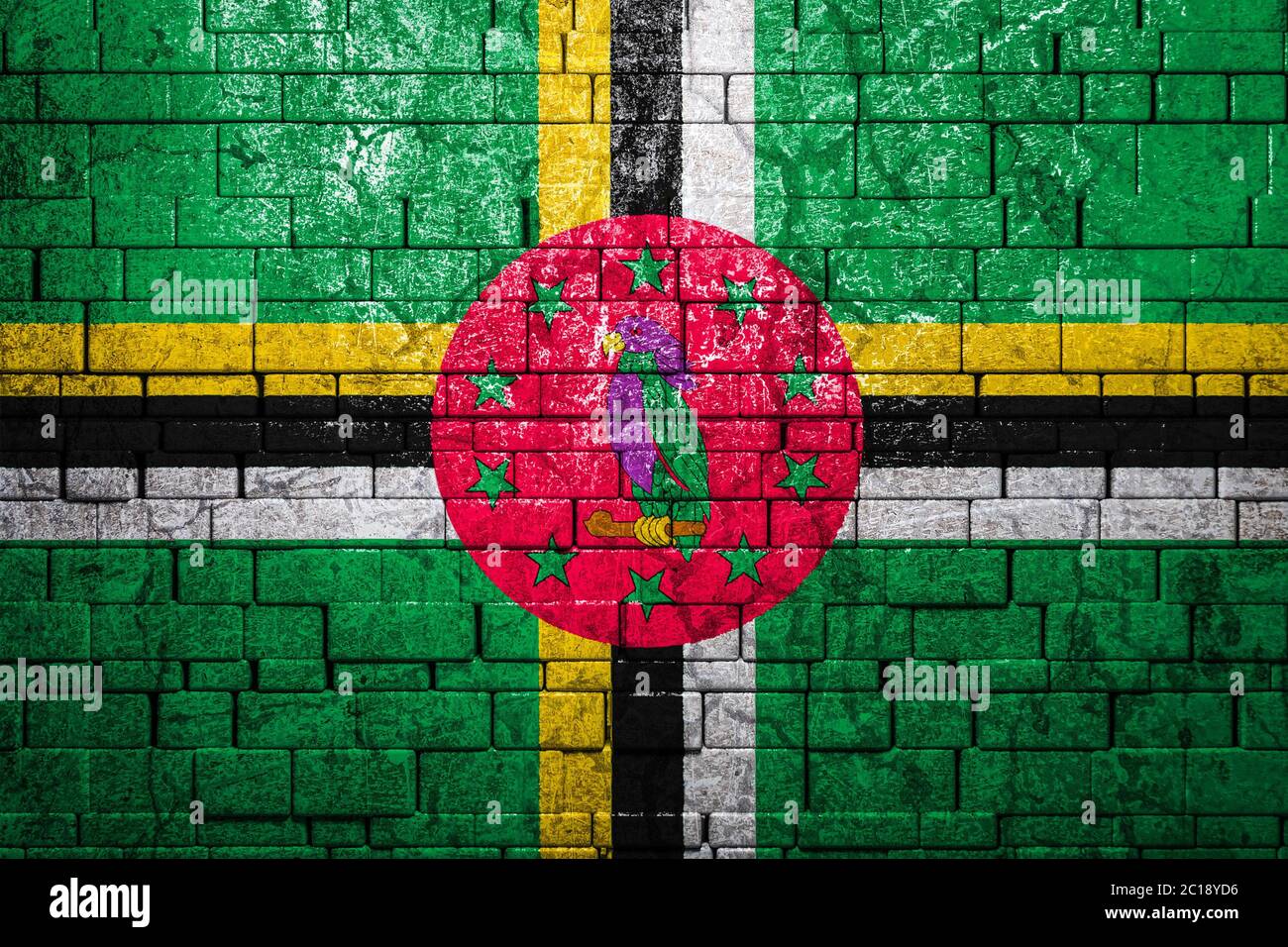 National flag of Dominica on brick wall background.The concept of ...