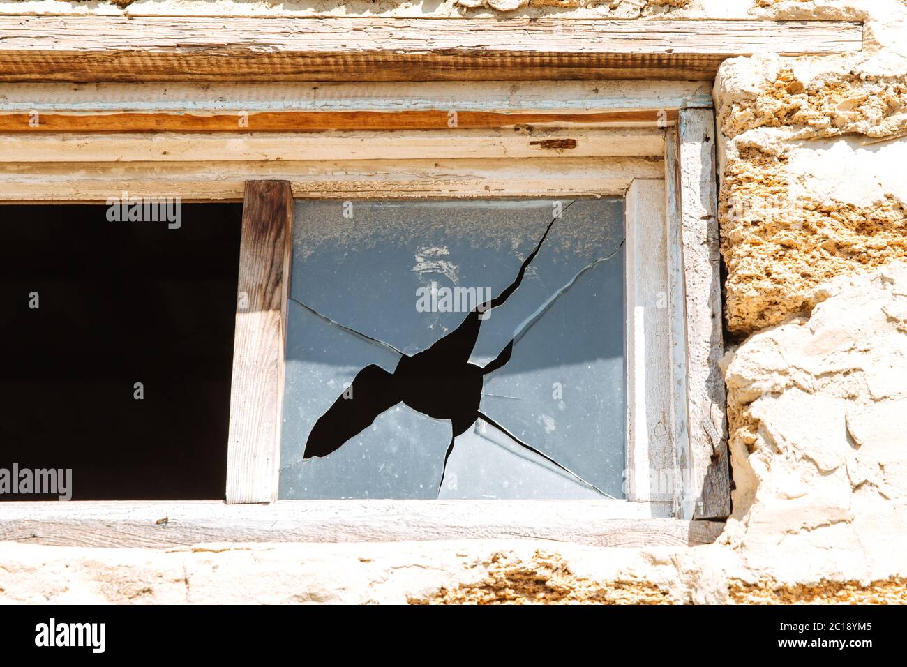 Broken glass in a building window. Housing problems Stock Photo - Alamy