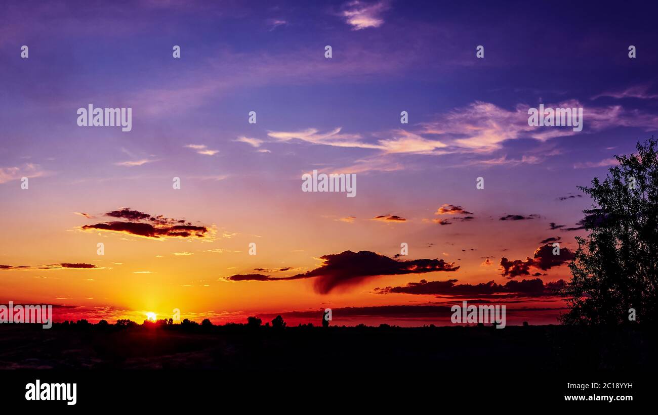 Bright sunlight through the clouds against a breathtaking evening sky ...