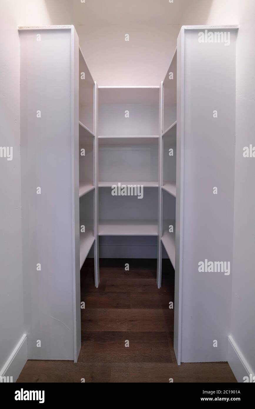 Empty interior of a walk-in closet interior Stock Photo - Alamy