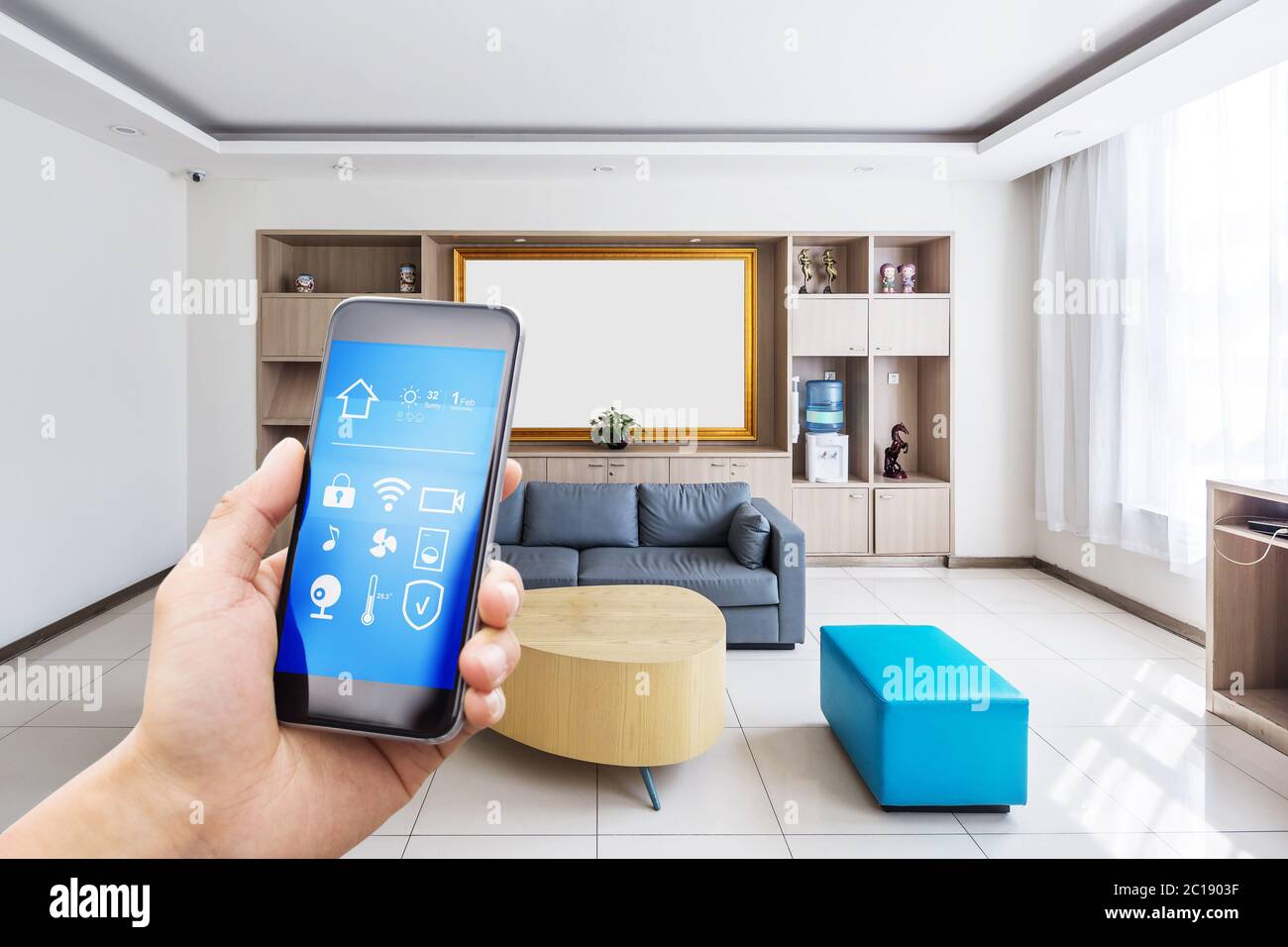 smart phone with smart home in modern living room Stock Photo - Alamy