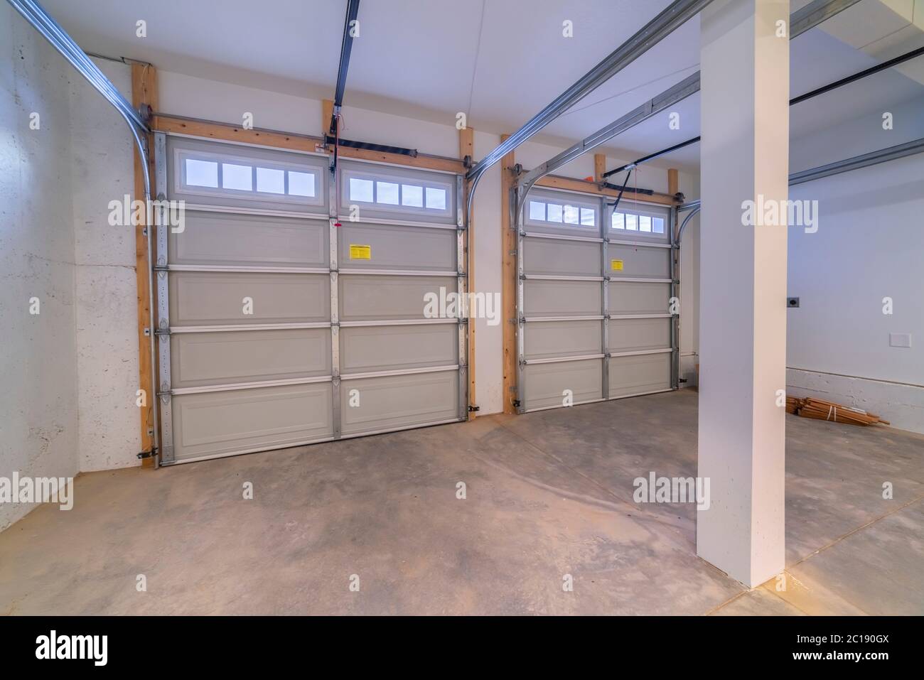 Inside an empty double vehicle garage interior Stock Photo - Alamy