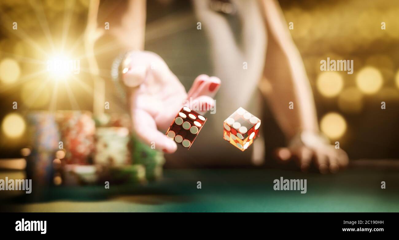 Woman throwing dice at casino hi-res stock photography and images - Alamy