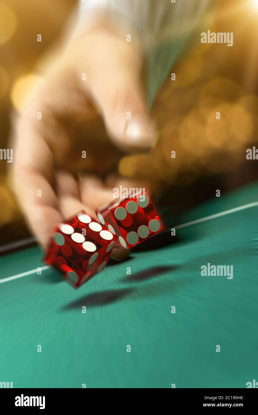 Man throwing dice at craps table hi-res stock photography and images ...