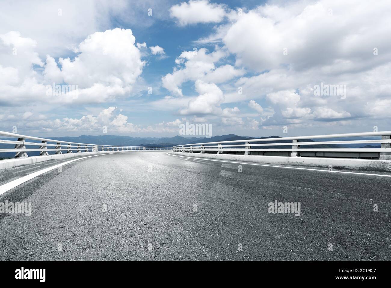 Empty road green hill hi-res stock photography and images - Alamy