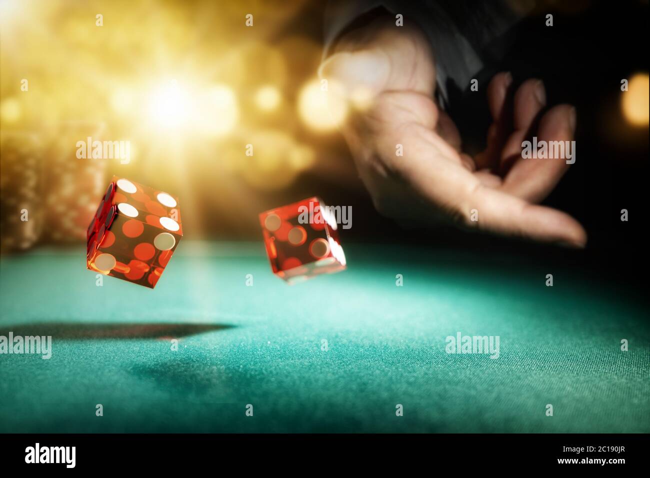 Man throwing dice at craps table hi-res stock photography and images ...