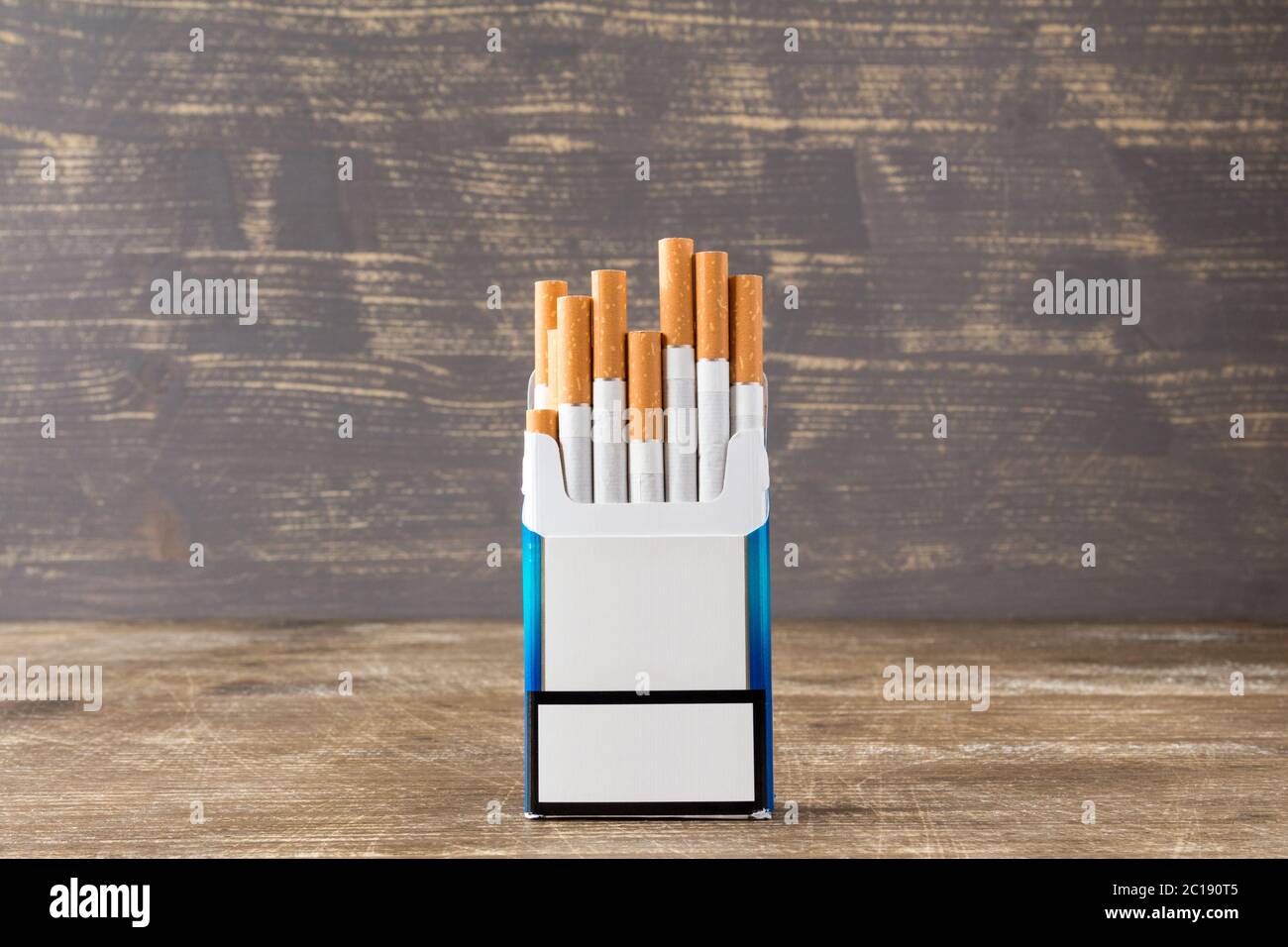 Open pack of cigarettes stands vertically Stock Photo - Alamy