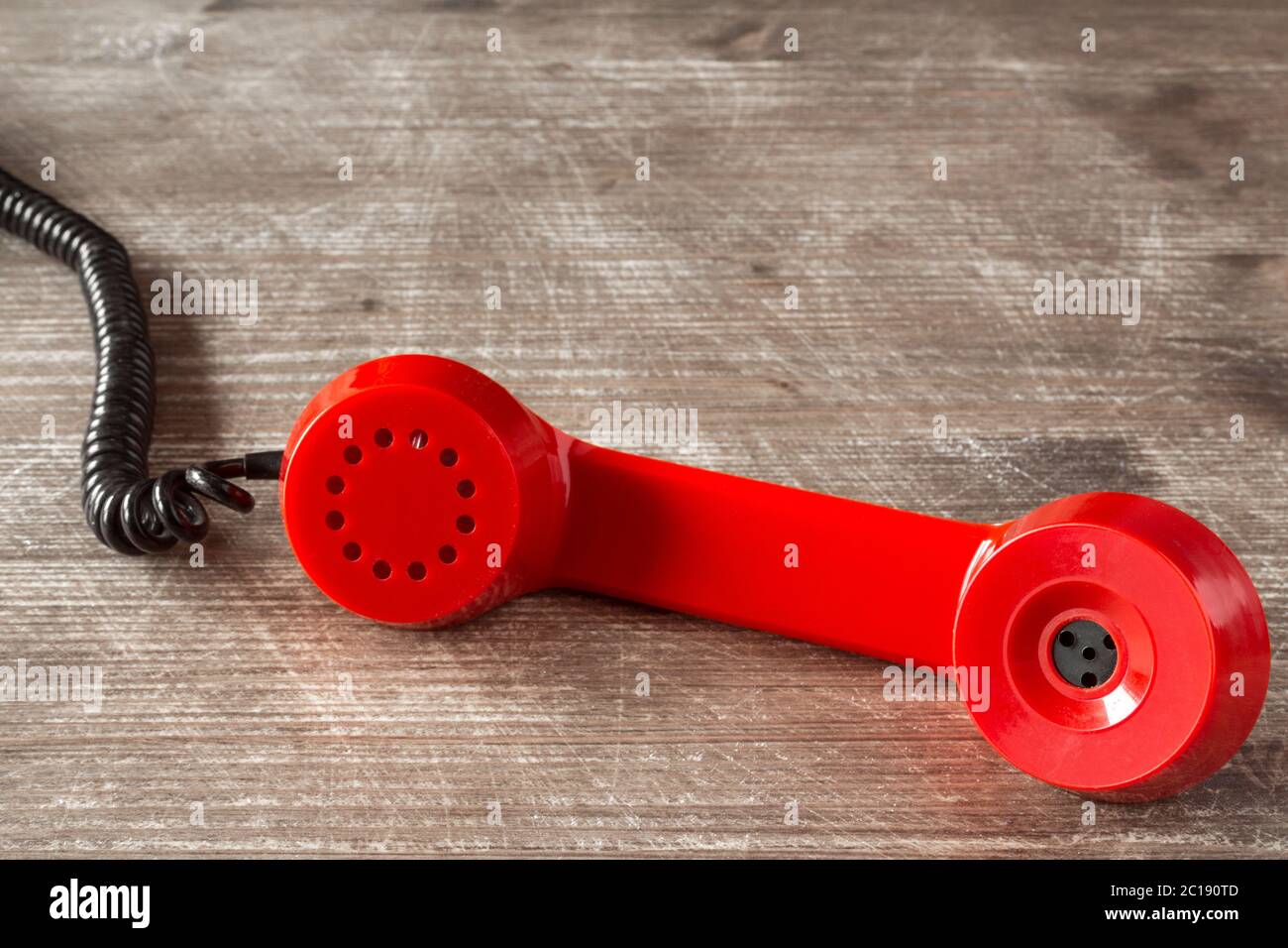 Red receiver of vintage telephone Stock Photo - Alamy