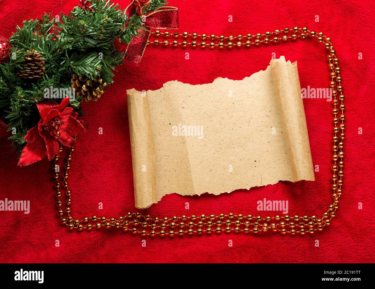 Christmas vintage scroll on red background Stock Photo - Alamy