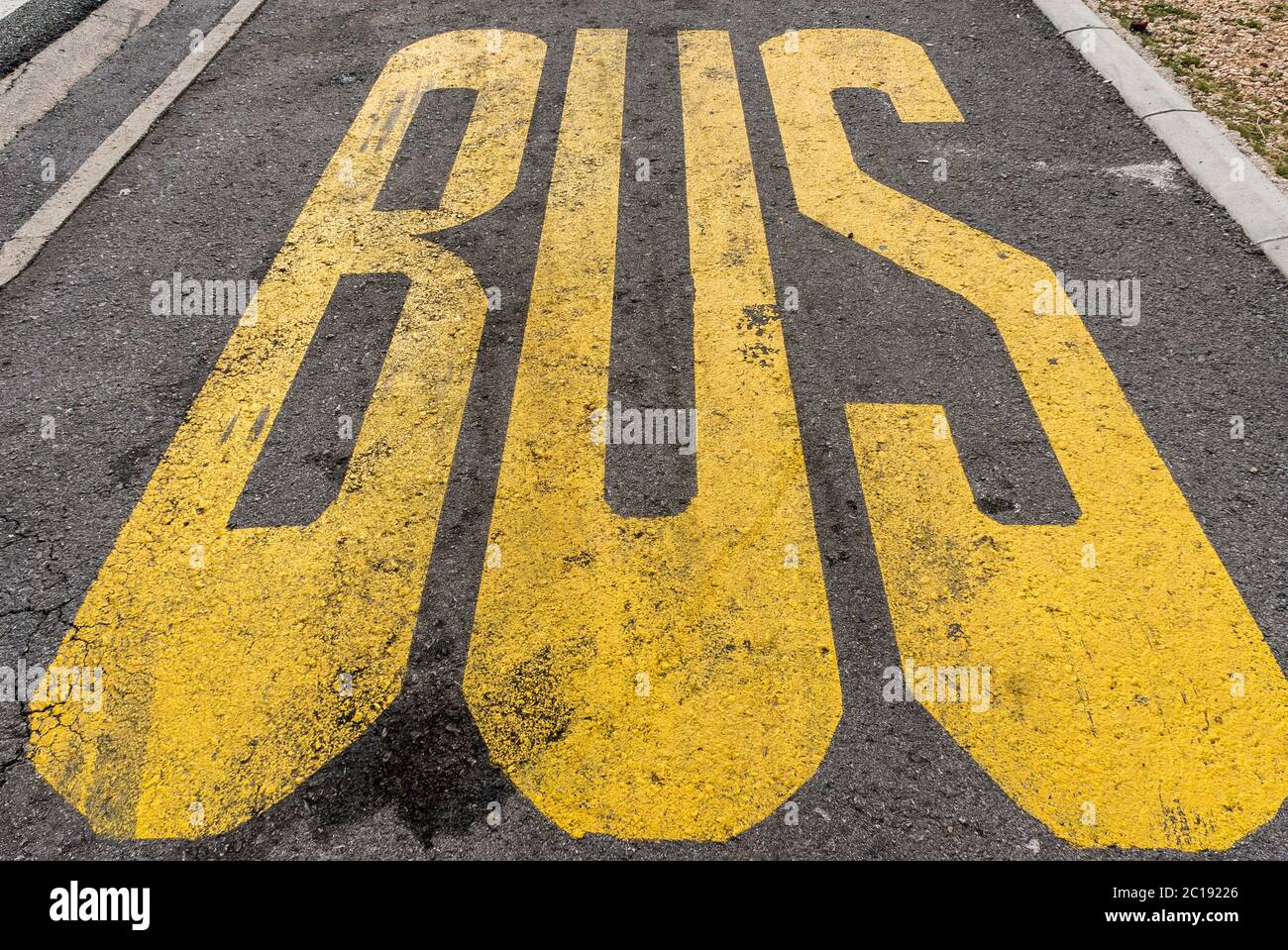 City bus transport lane sign on the asphalt road Stock Photo - Alamy