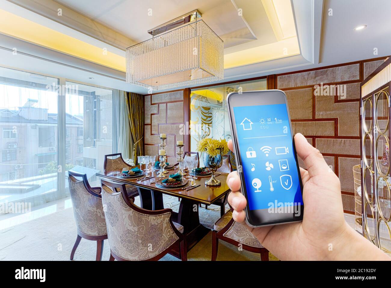smart phone with smart home with modern dining room Stock Photo - Alamy