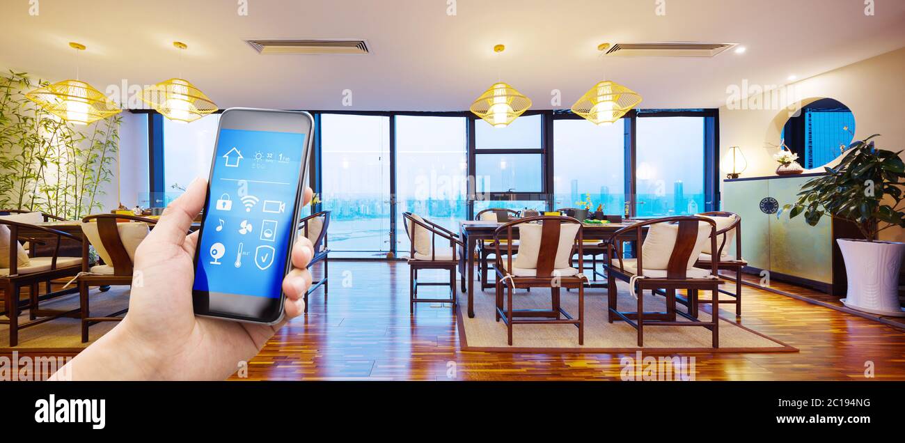 smart phone with smart home with modern dining room Stock Photo - Alamy