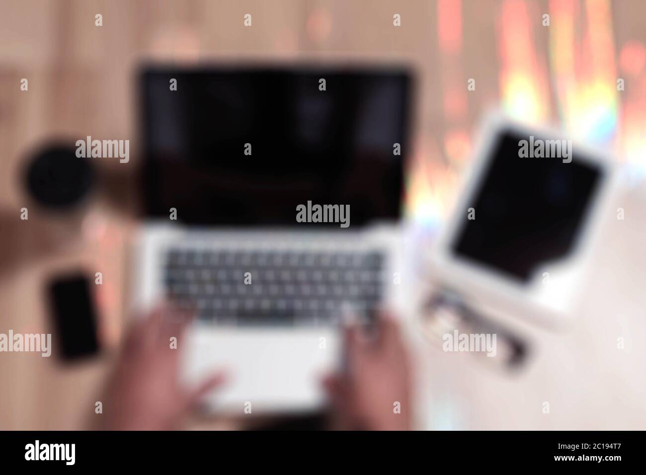 Hands on notebook with blurred images Stock Photo - Alamy