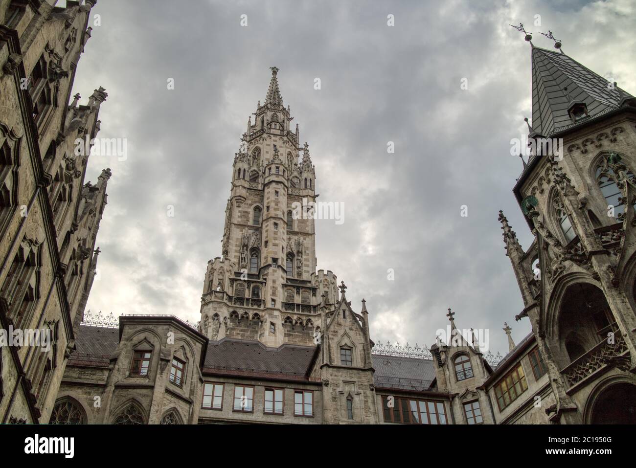 Old-fashioned architectural buildings against grey cloudy sky in Munich ...