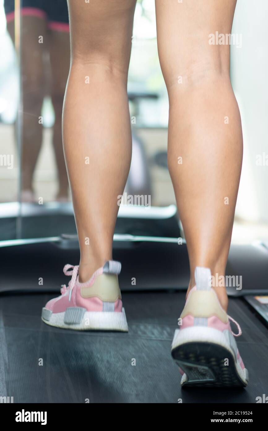 The detail of legs running on a treadmill at fitness club Stock Photo ...