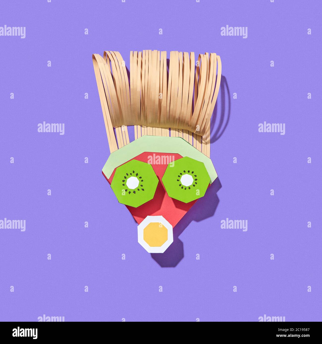 Papercraft face made from colorful fruits pieces Stock Photo - Alamy