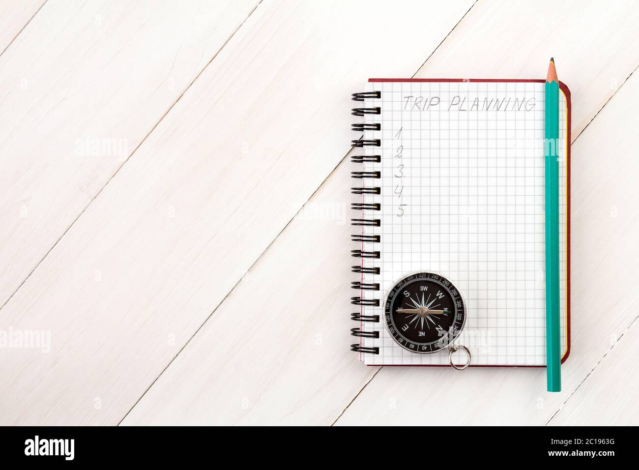 Traveler's notebook with compass and pencil Stock Photo - Alamy