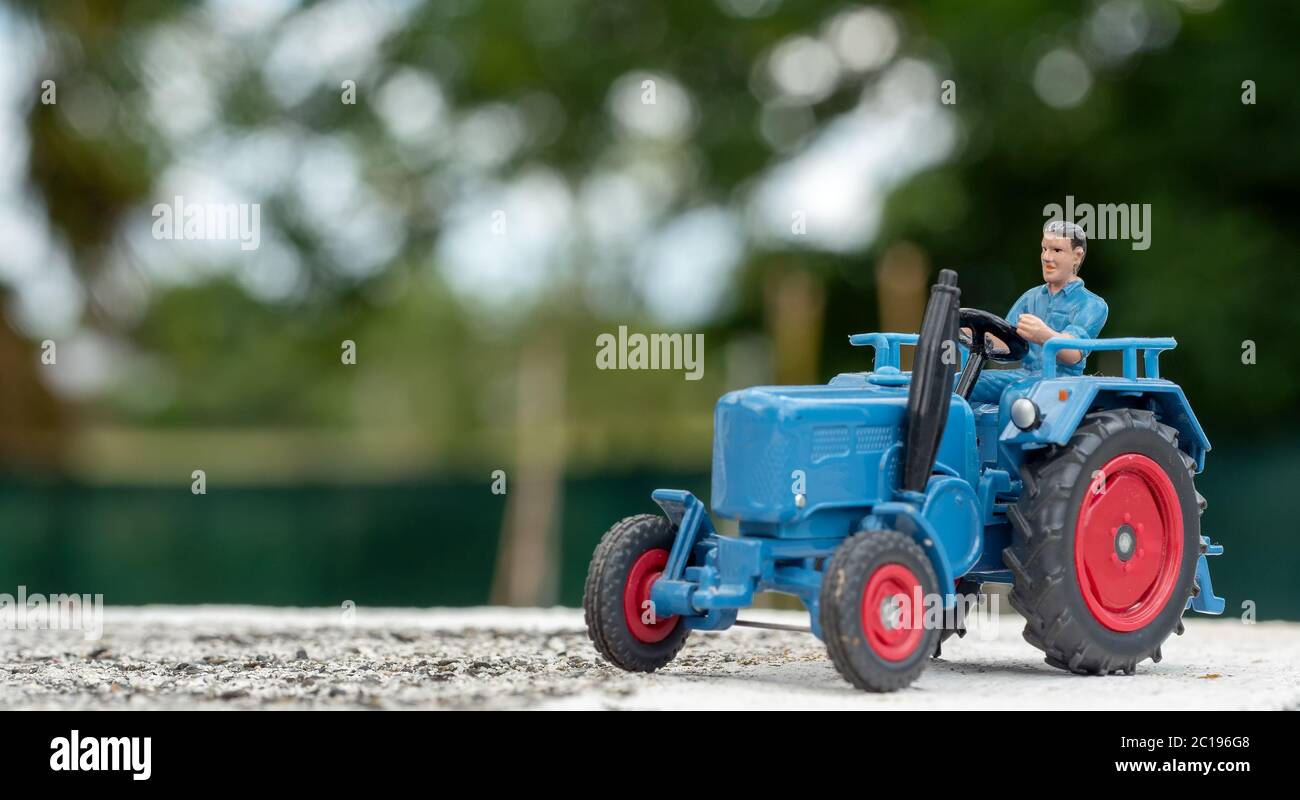 a blue tractor toy model Stock Photo - Alamy