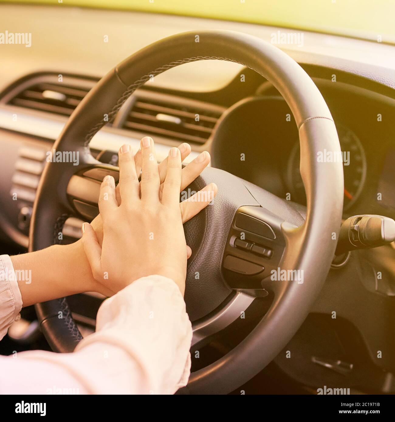 Unhappy girl driver. Shocked and scared Stock Photo - Alamy