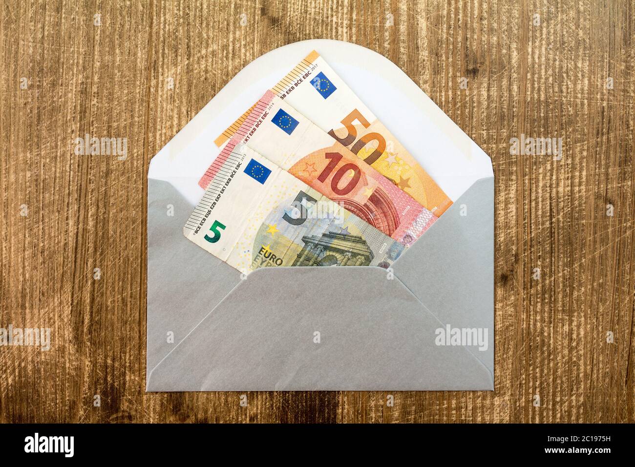 Silver envelope with Euro currency Stock Photo - Alamy