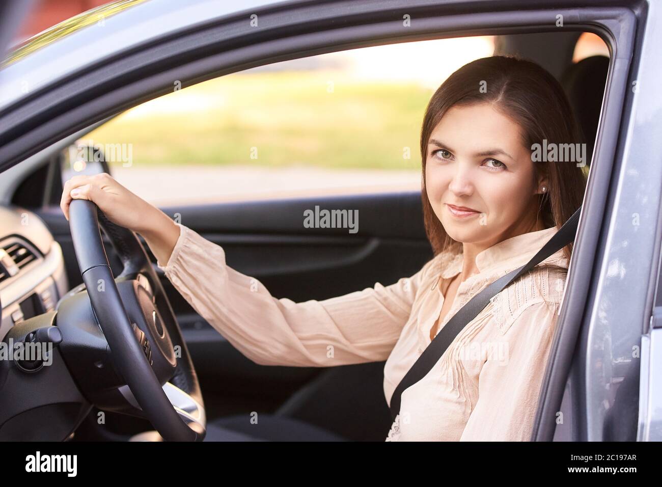 Young girl face. Rental car driver. buying new jeep Stock Photo - Alamy